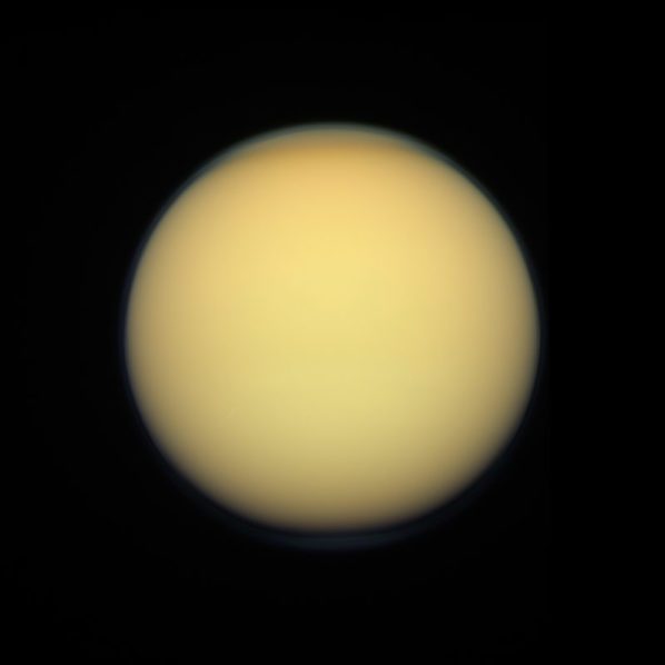 Why Does Titan Have a Dense Atmosphere?