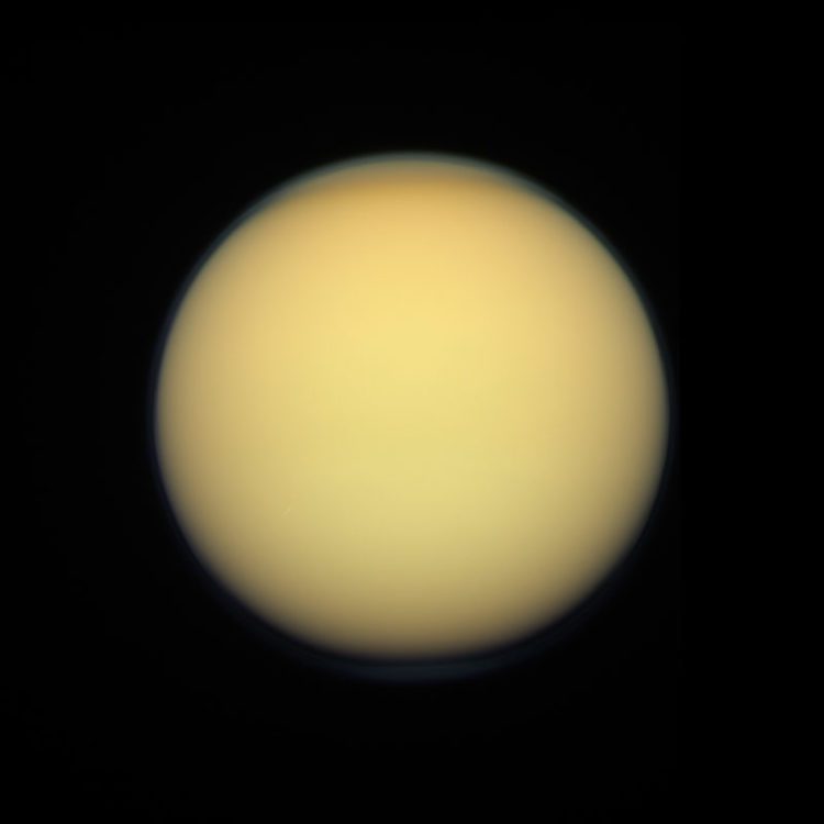 Why Does Titan Have a Dense Atmosphere?